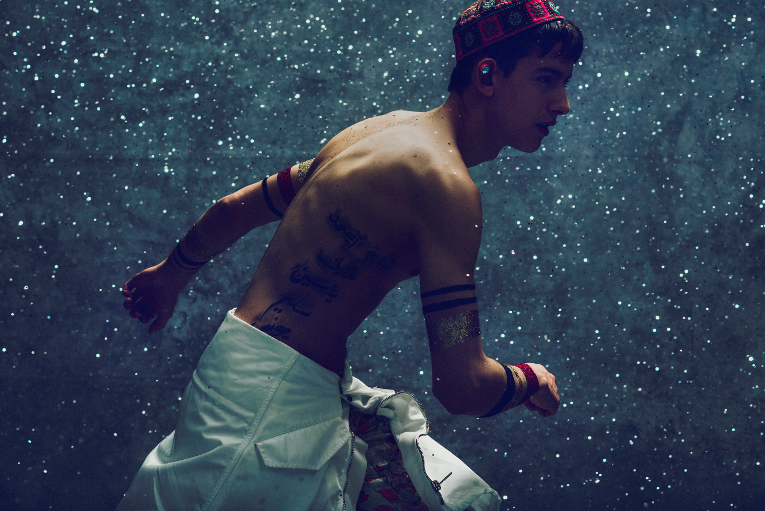 Glitter: Jamil Issa Strikes a Pose for Wonderland – The Fashionisto